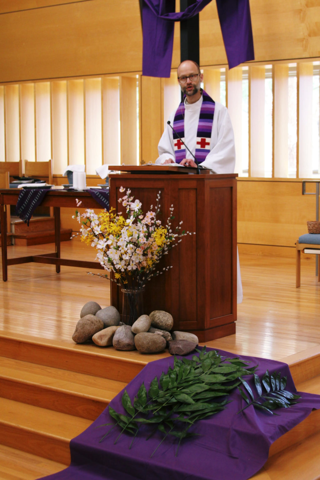 What does the flower display at the front of the sanctuary pulpit mean ...